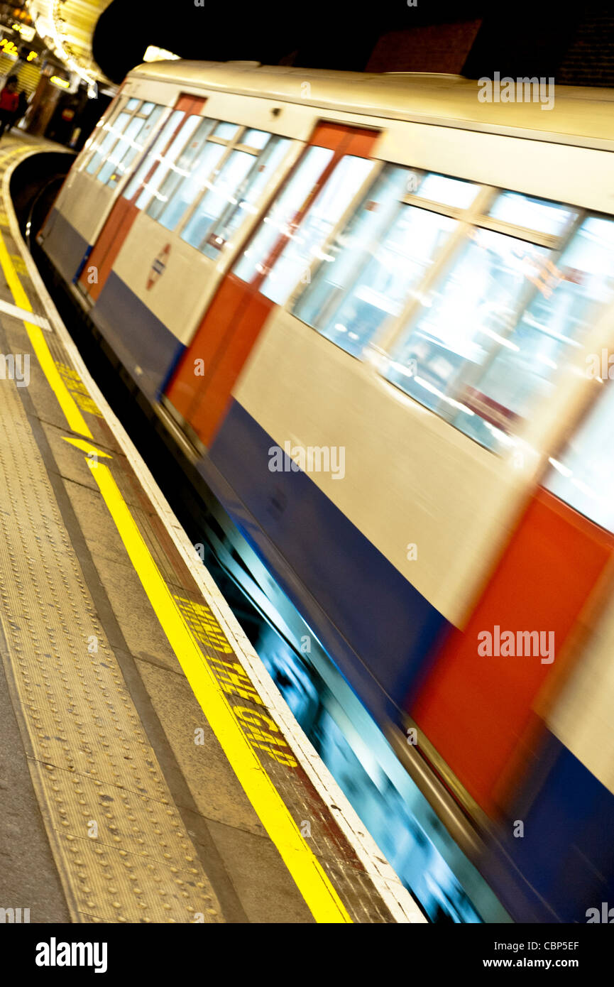 London Tube Train Moving through station Stock Photo - Alamy
