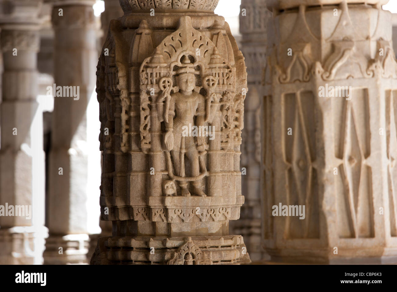 Stone carvings and marble pillars at The Ranakpur Jain Temple at Desuri ...