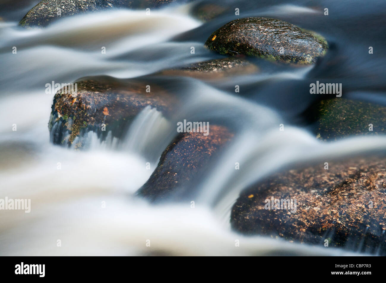 Water rushing over river rocks hi-res stock photography and images - Alamy