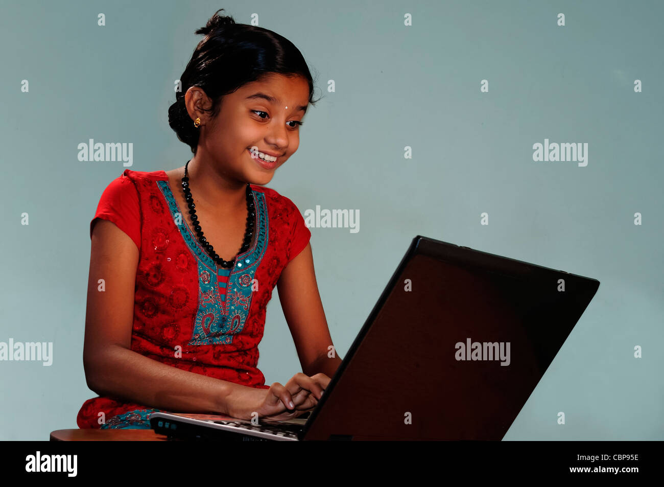 little school girl with computer Stock Photo - Alamy