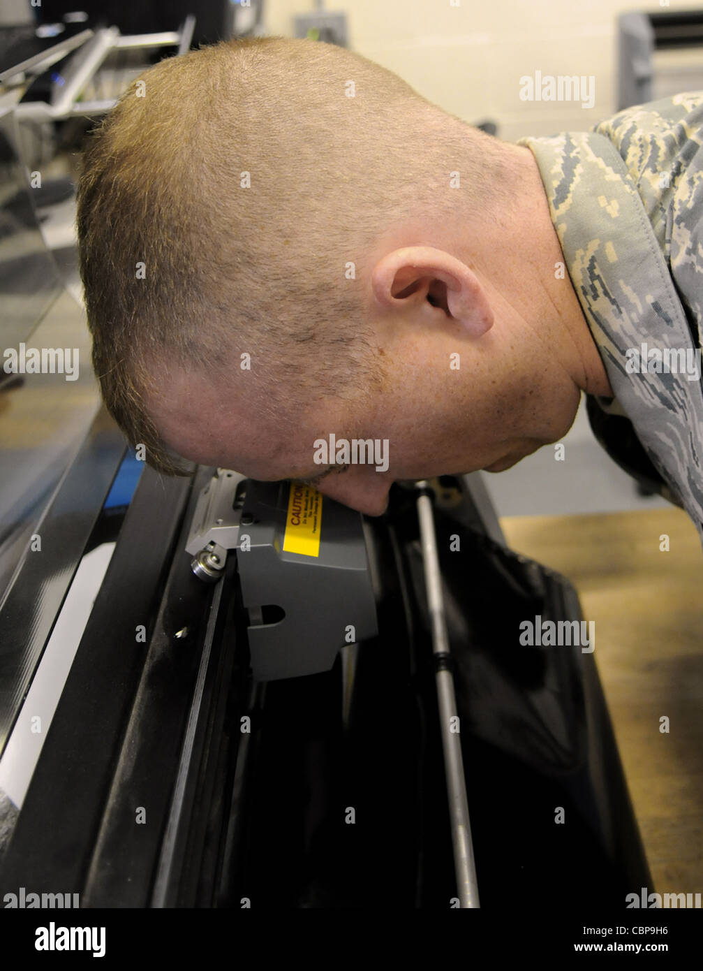 Staff Sgt. Christopher Breaux uses a "bomb sight" to line up a ...