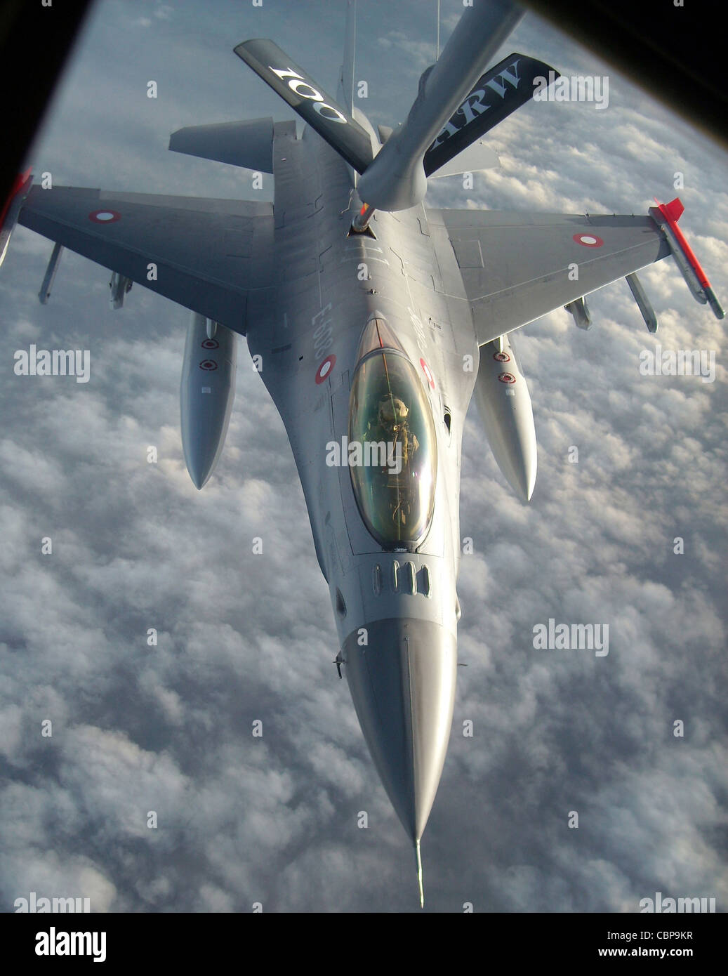 A Royal Danish air force F-16 Fighting Falcon receives fuel Dec. 8 ...