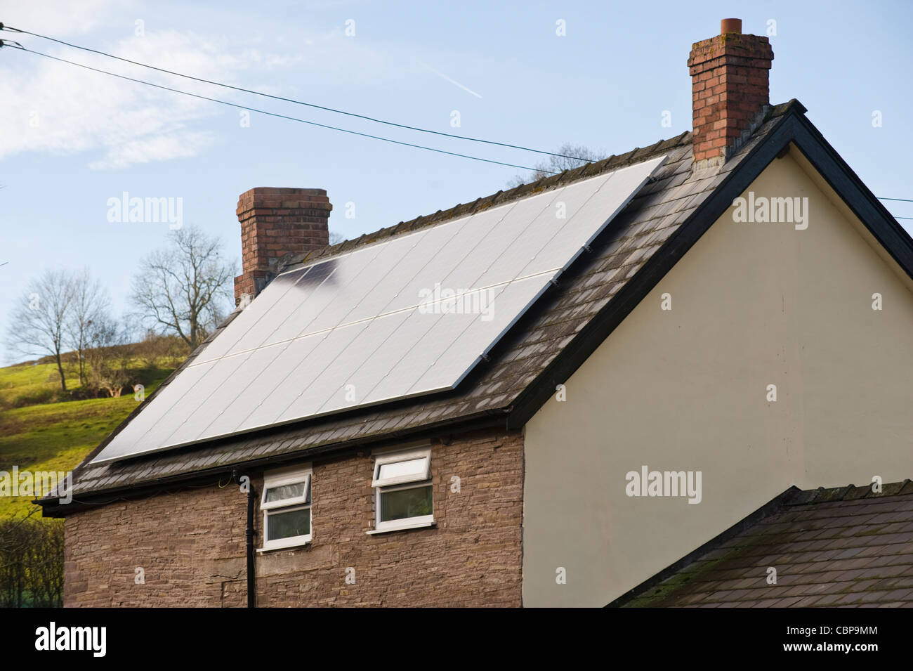Solar panels for electricity generation on roof of rural detached house ...