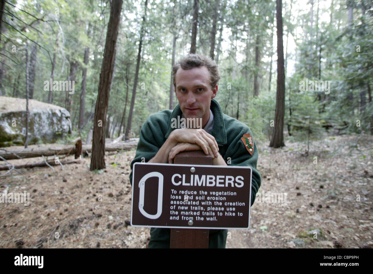 CYosemite Park Climbing Ranger Lincoln Else stands behind a sign he ...