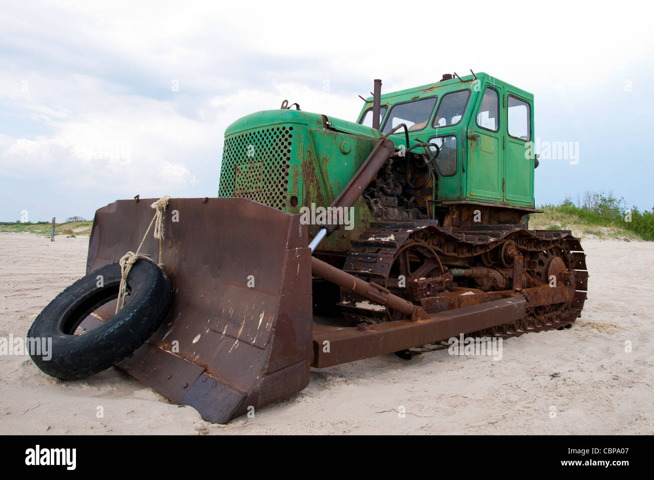 Old seaside bulldozer used for pulling fishing boats up the beach and ...