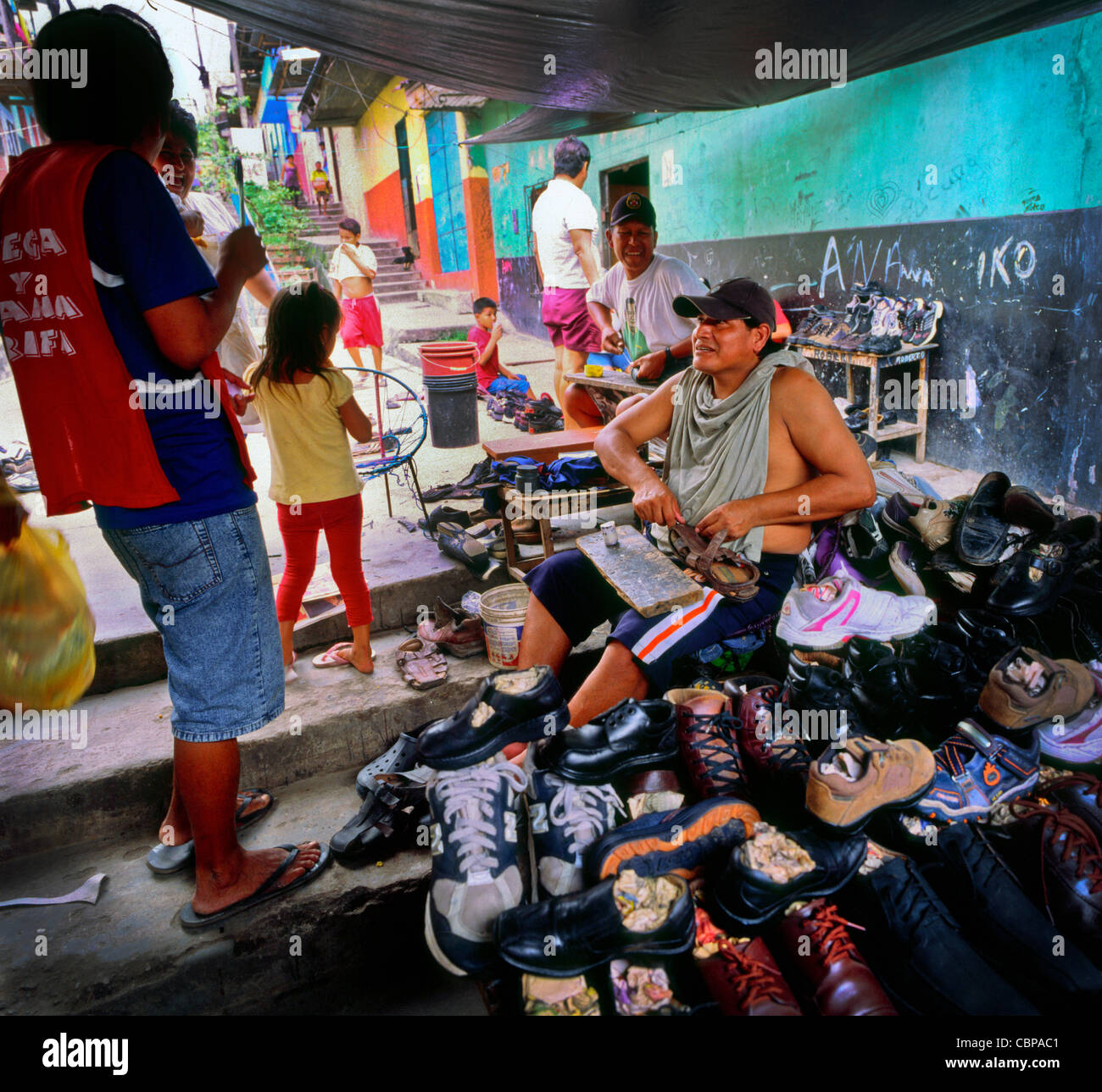 A cobbler in Belen repairing a shoe happy in his work Stock Photo - Alamy