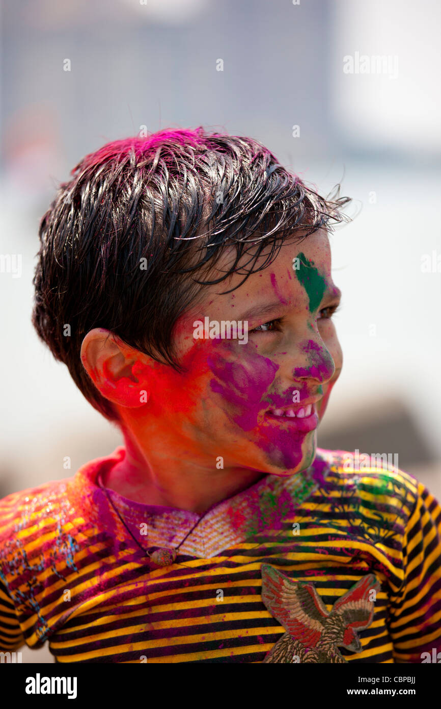 Indian boy celebrating Hindu Holi festival of colours with powder ...