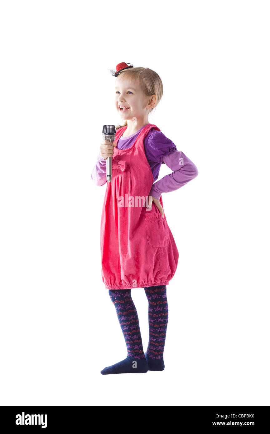 Young girl with a microphone singing Stock Photo - Alamy