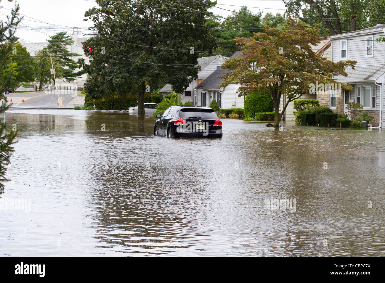 Flooded car parked on the street - Hurricane Irene aftermath, New ... Flooded car parked on the street - Hurricane Irene aftermath, New ...
