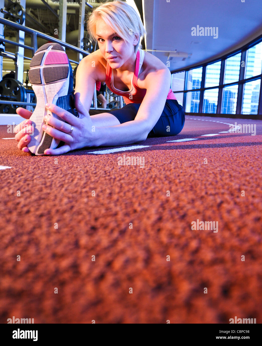 Woman stretches in preparation for workout Stock Photo - Alamy