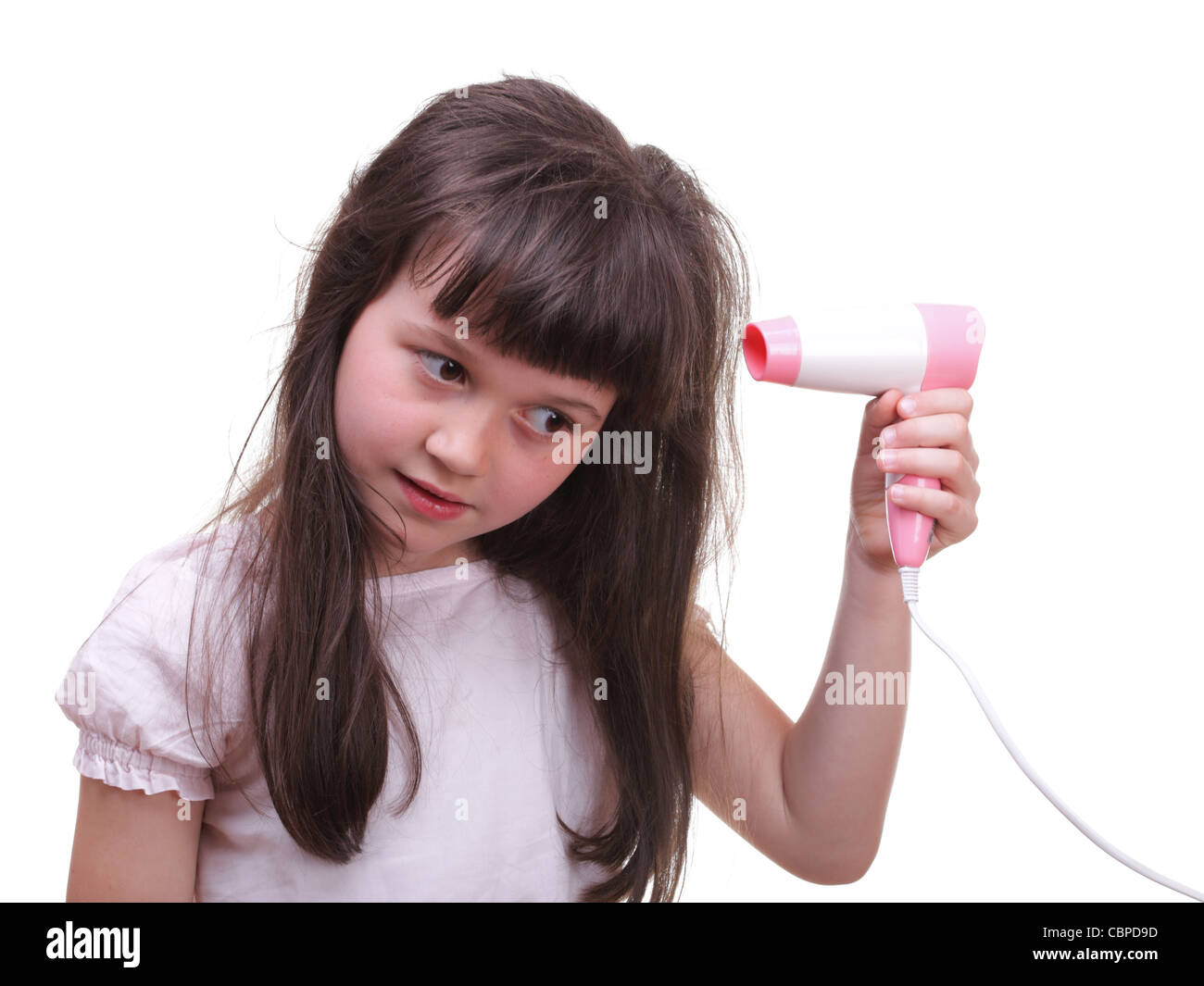 Pretty girl drying her hair hairdryer isolated on white Stock Photo - Alamy