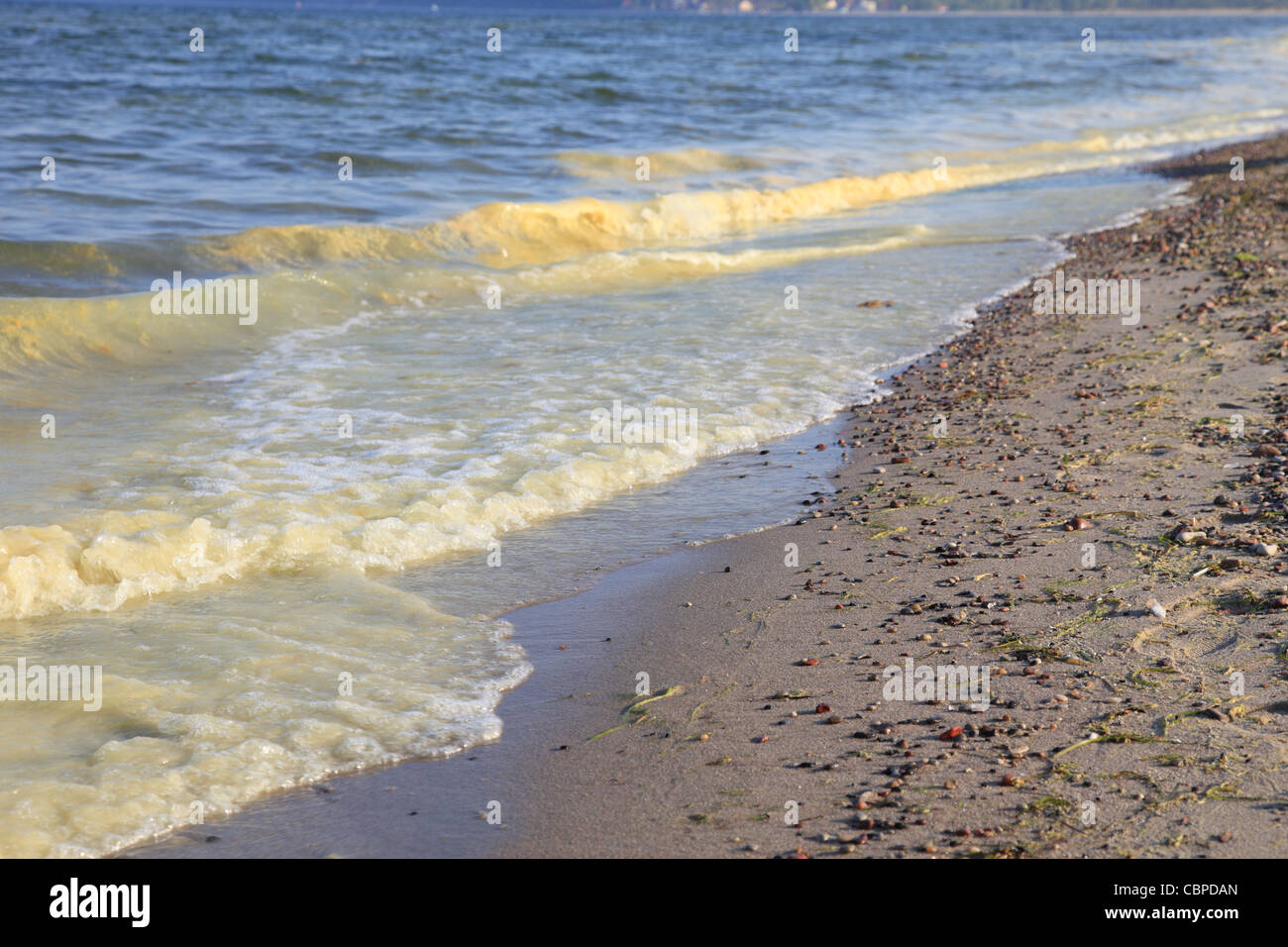 spill disaster on sea yellow pollution Stock Photo - Alamy