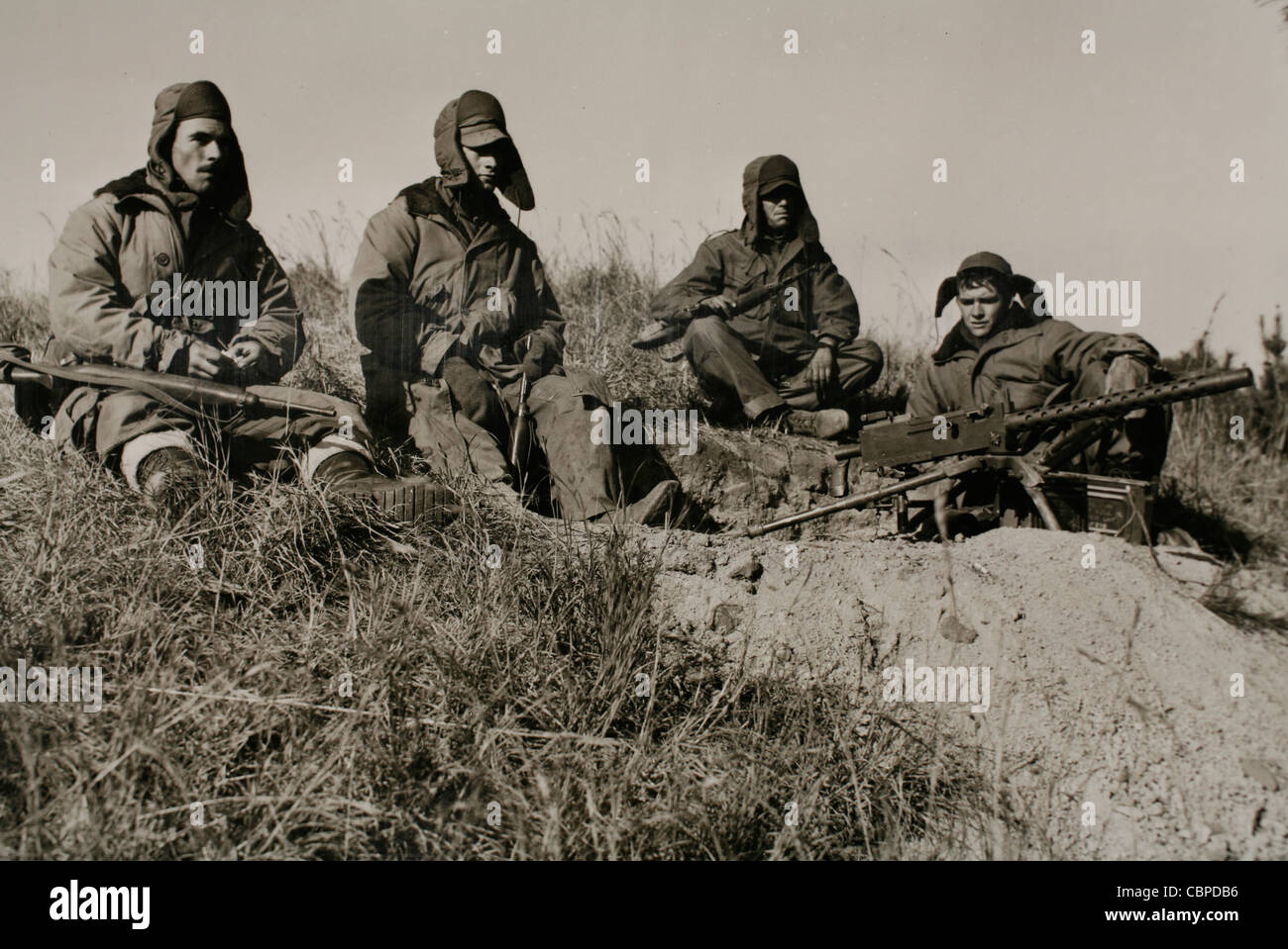 Machine gun crew of the 1st Marine Regt. taking it easy in South Korea ...