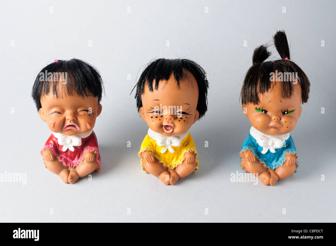 Trio of dolls with different emotions Stock Photo - Alamy