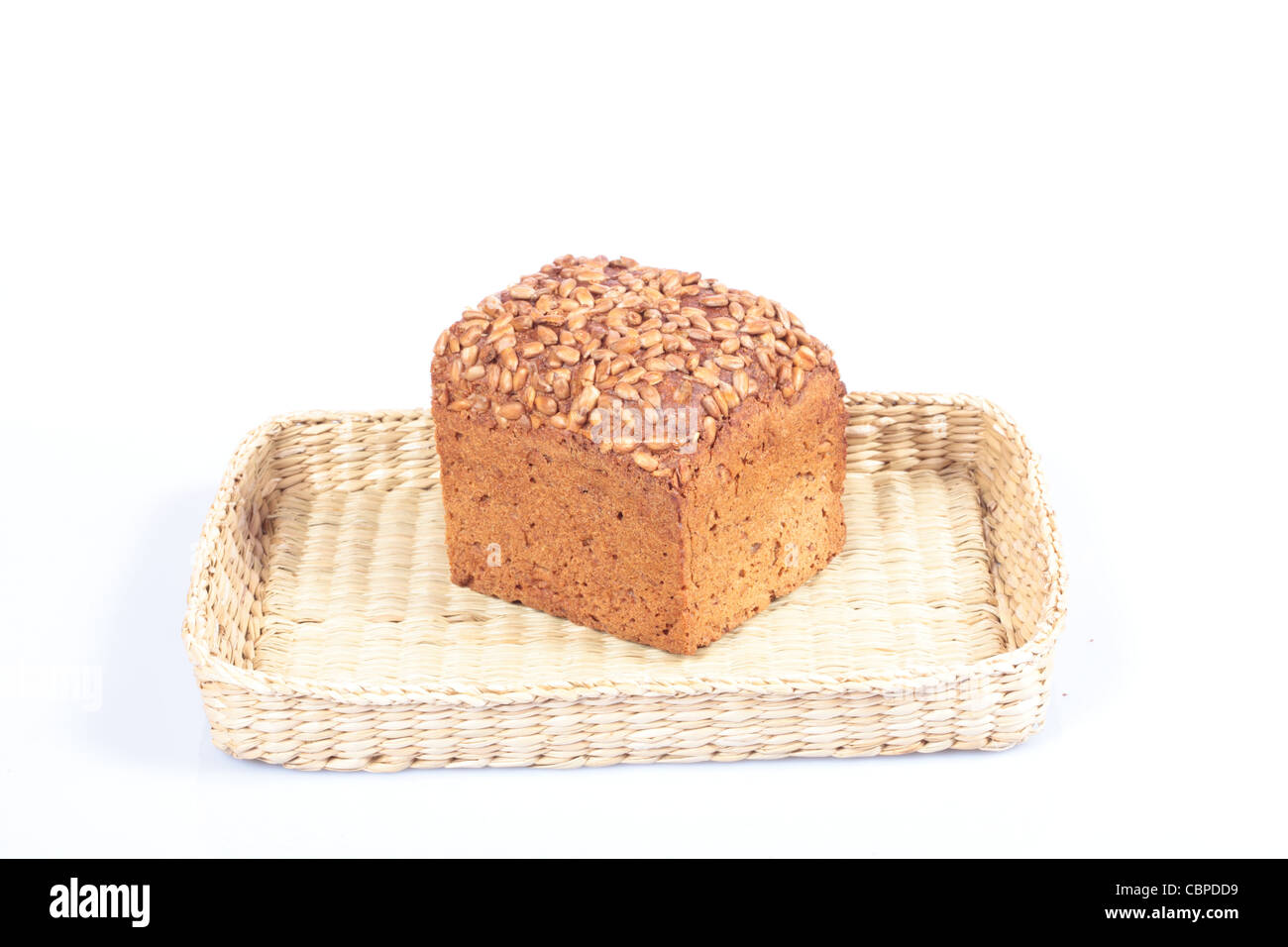 wholegrain bread on board isolated white background Stock Photo - Alamy