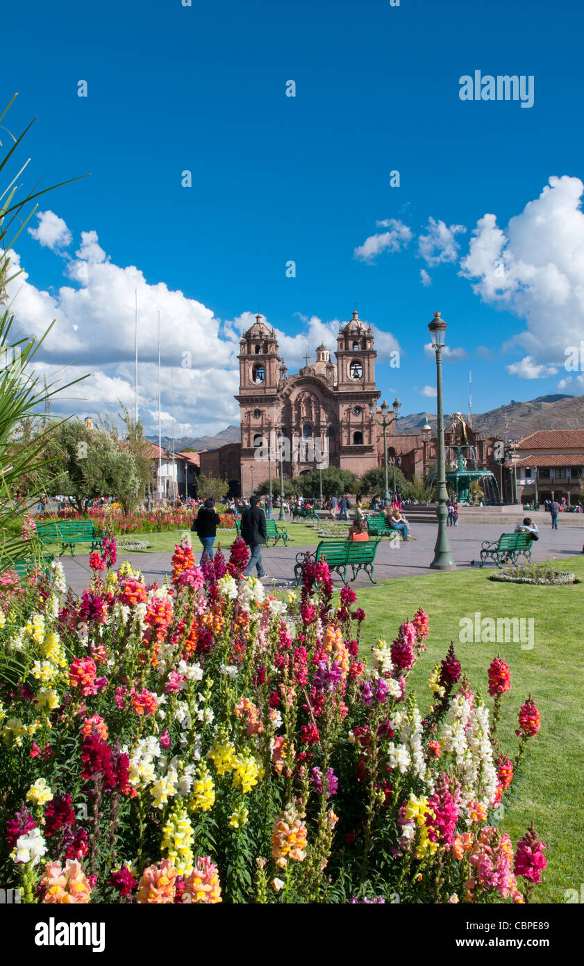 Beautiful visual image of Main Square thru flowers in sunshine of Cusco ...