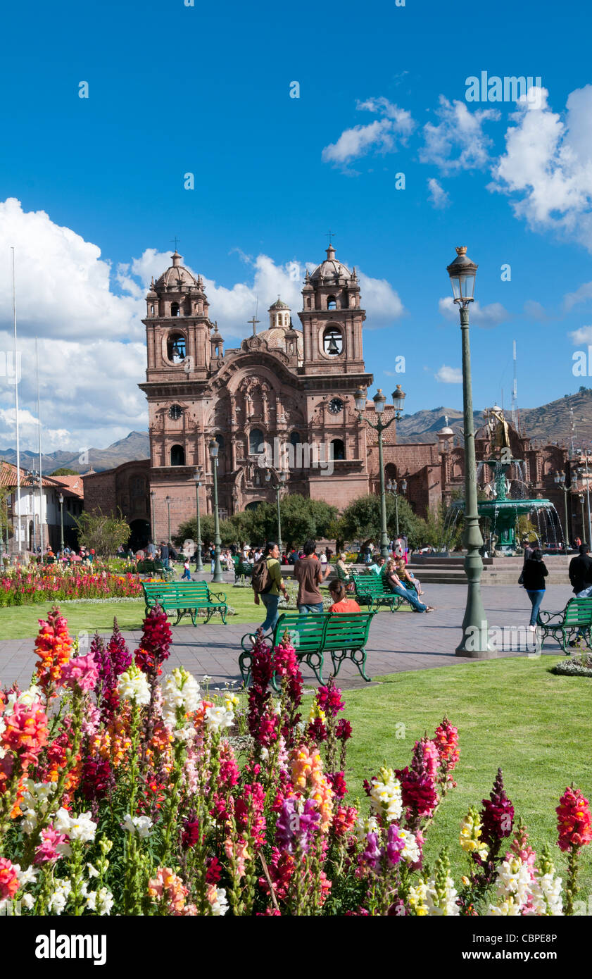 Beautiful visual image of Main Square thru flowers in sunshine of Cusco ...