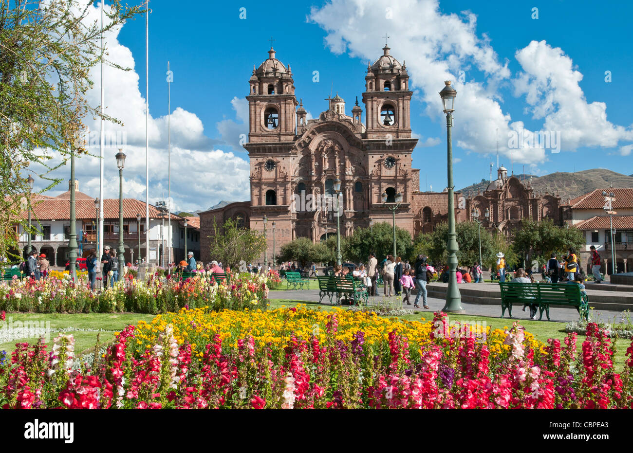 Beautiful visual image of Main Square thru flowers in sunshine of Cusco ...