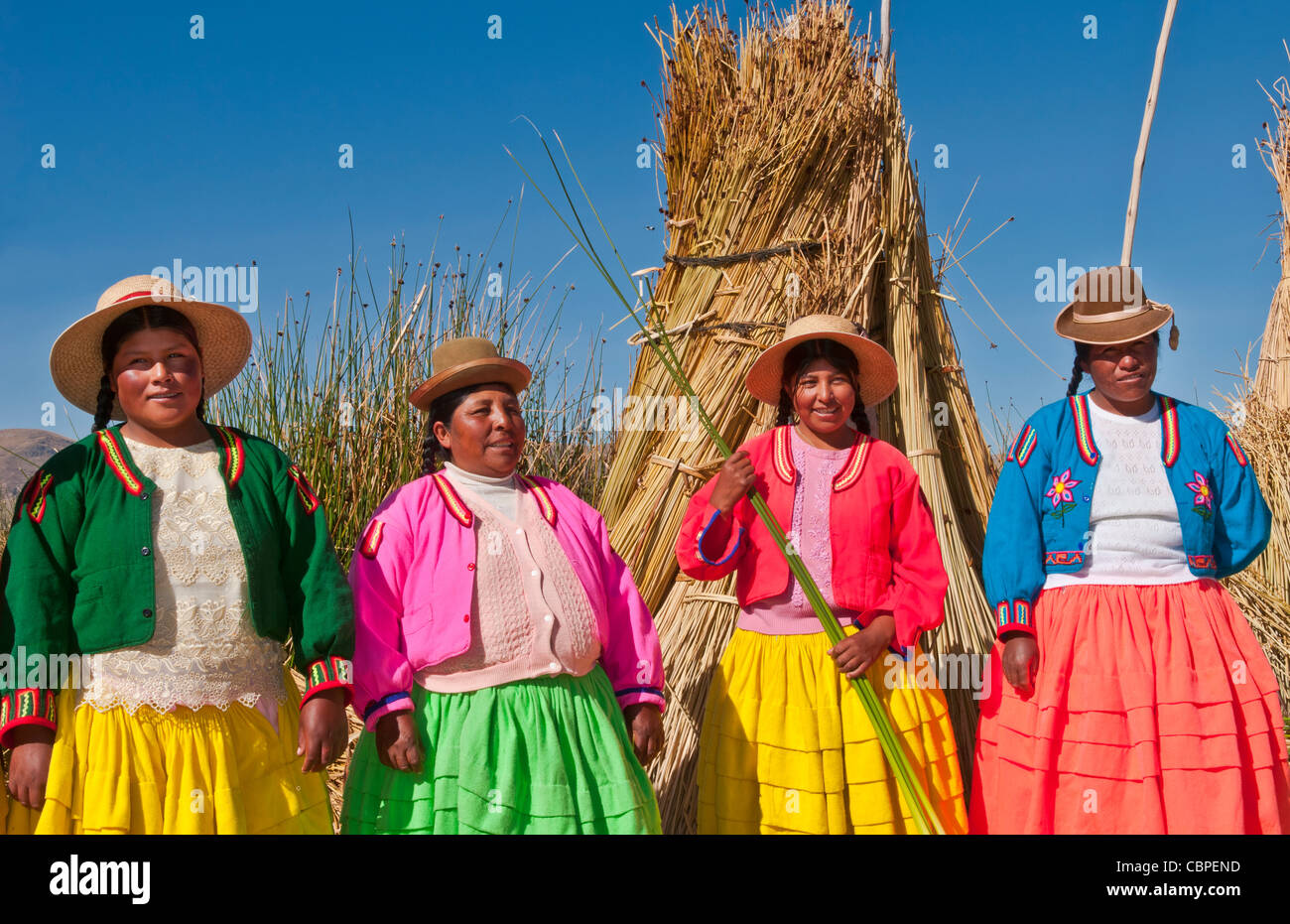 Lake Titicaca Peru with local traditional women of Uros Tribe history ...