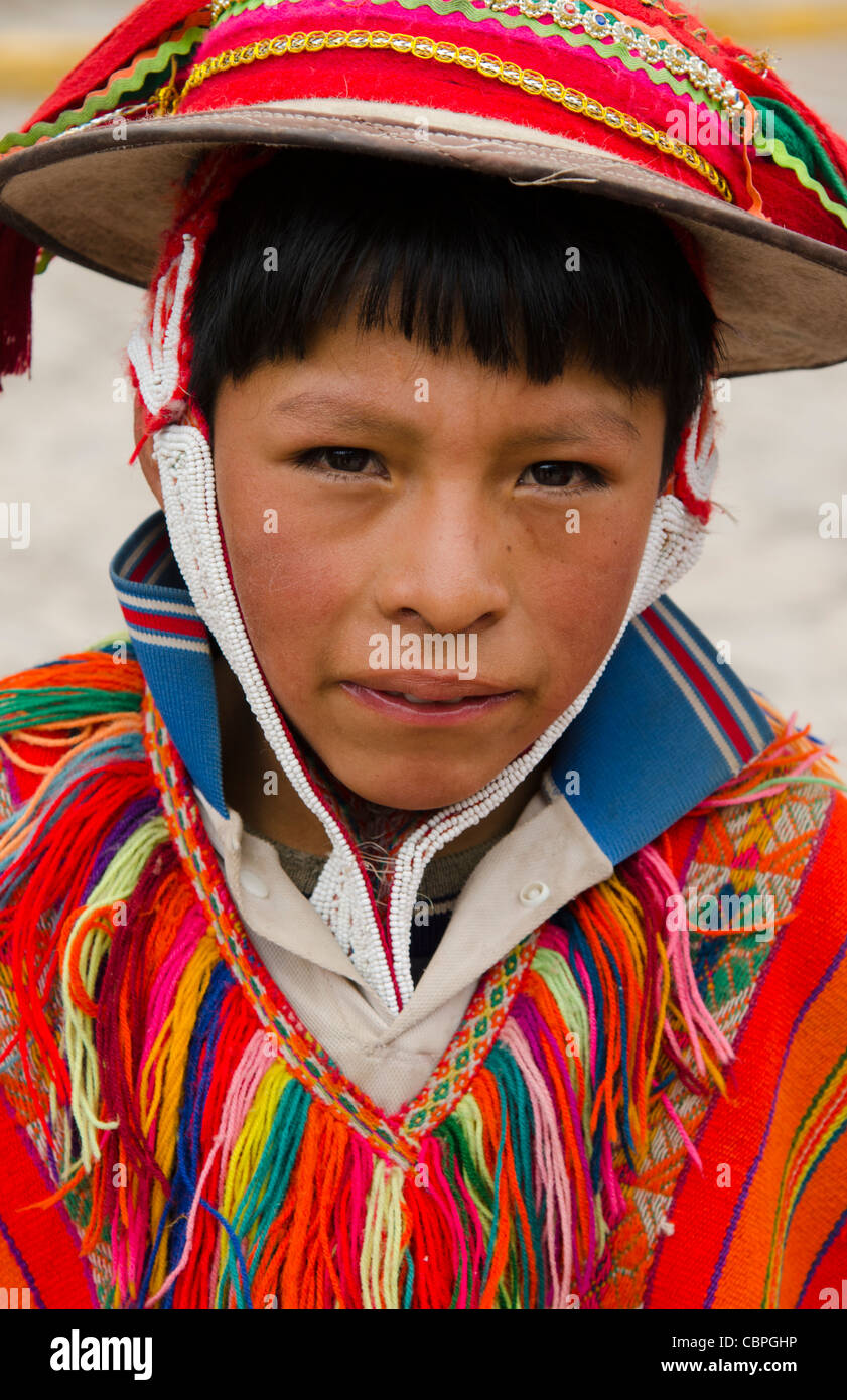 Portrait of young boy, with traditional dress in small town of Pisaq ...