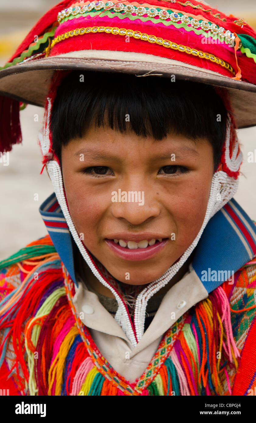 Portrait of young boy, with traditional dress in small town of Pisaq ...