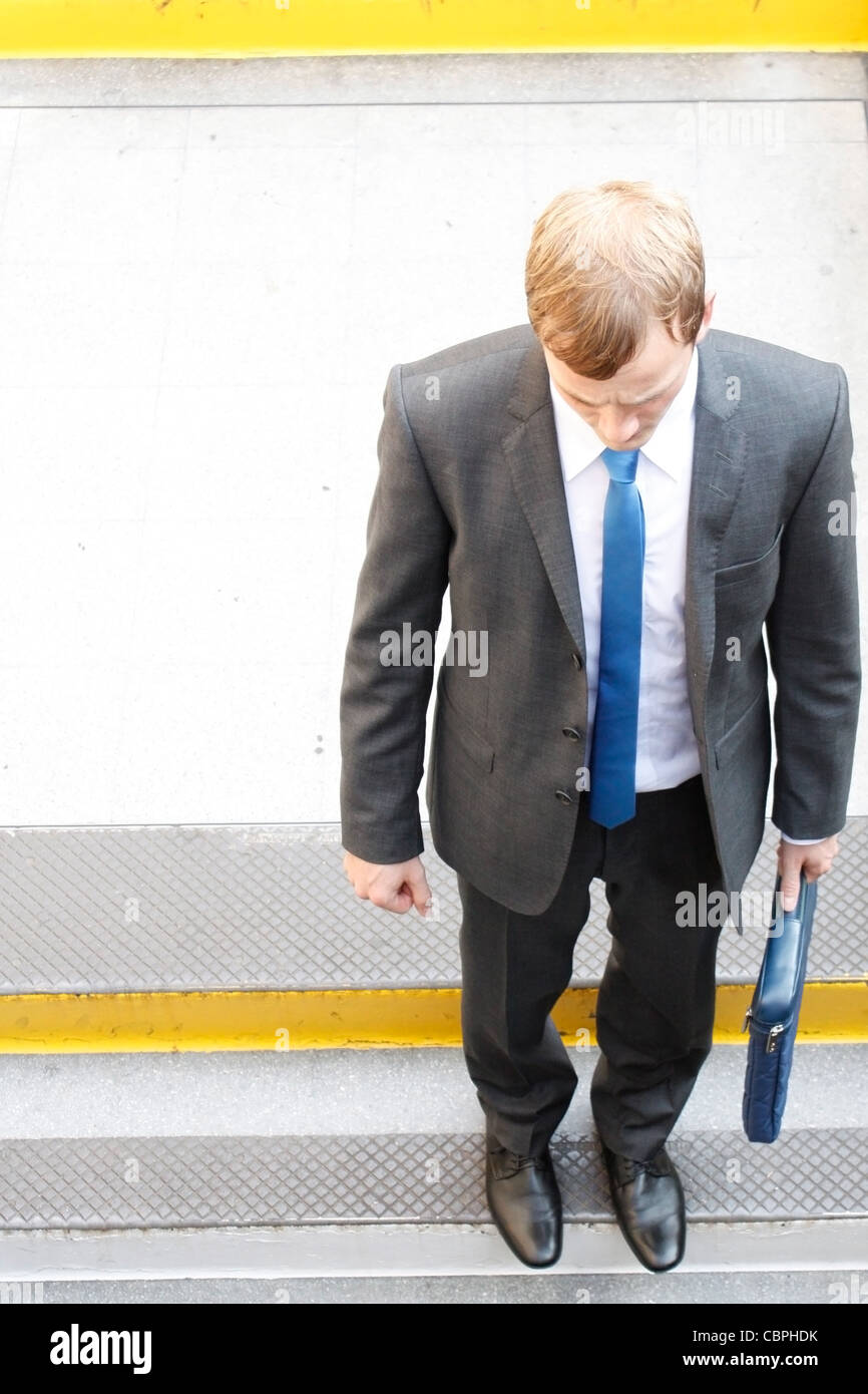 A business man walking down some steps Stock Photo - Alamy