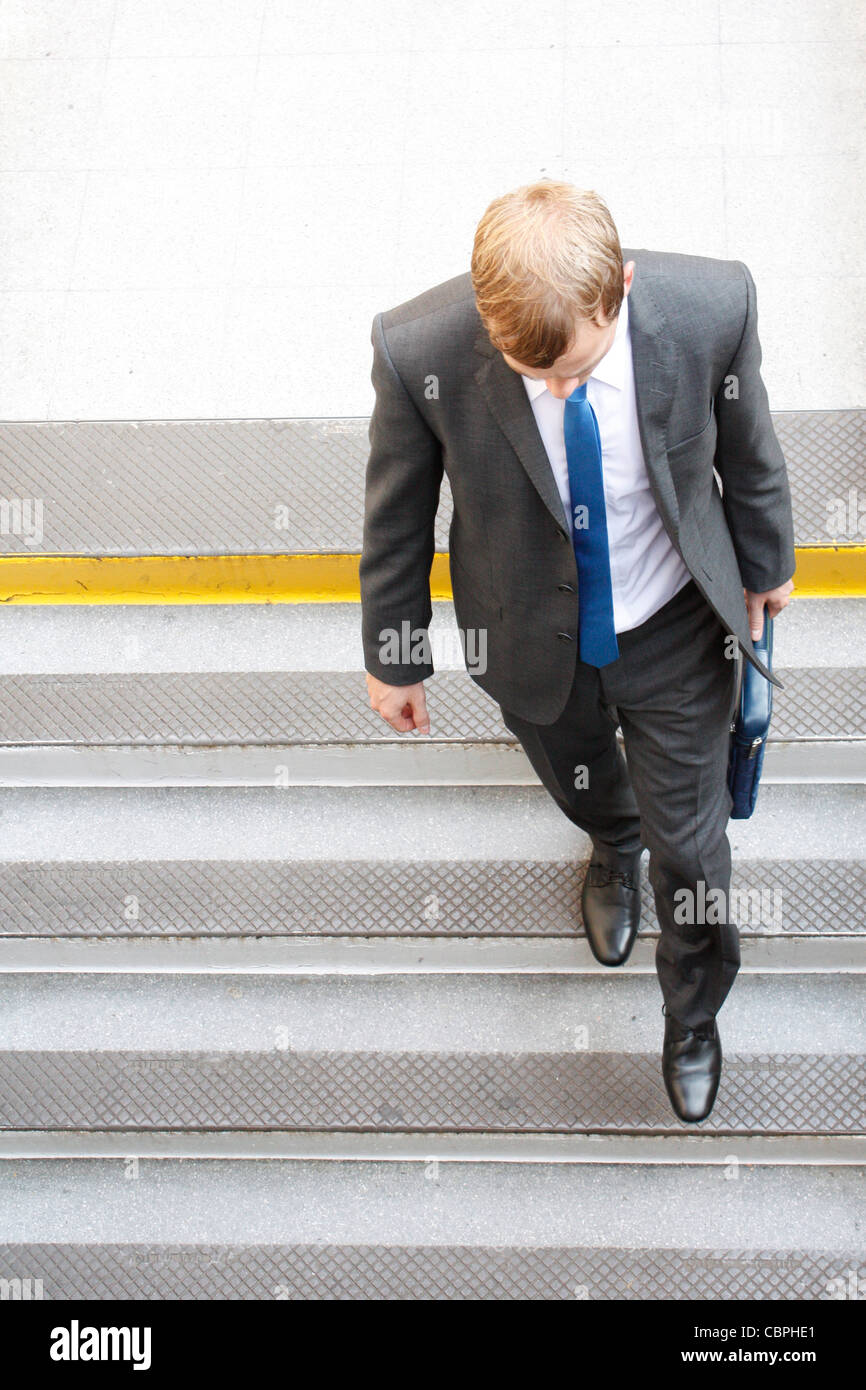 A business man walking down some steps Stock Photo - Alamy