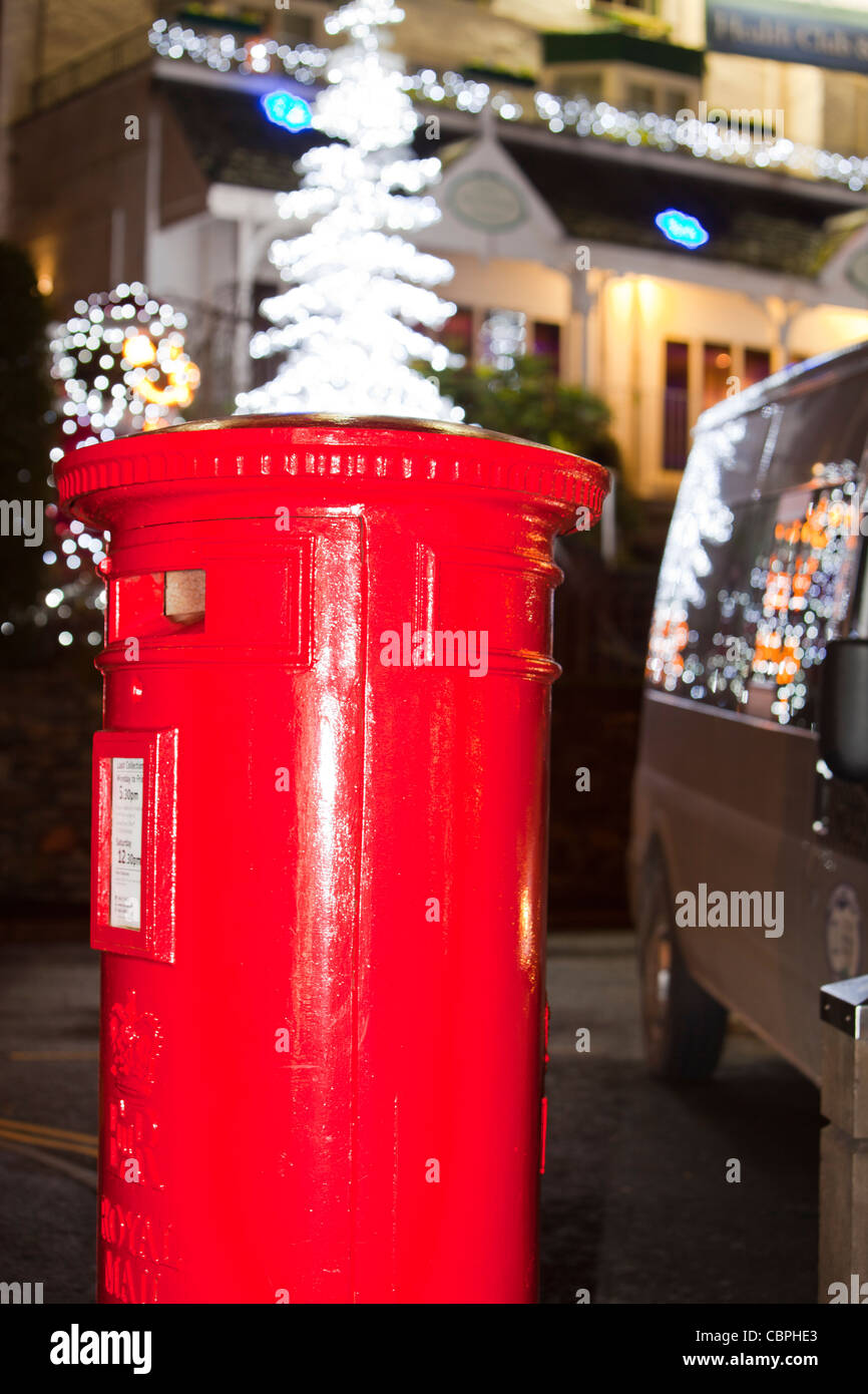 A christmas tree and post box in the centre of Ambleside, Lake District ...
