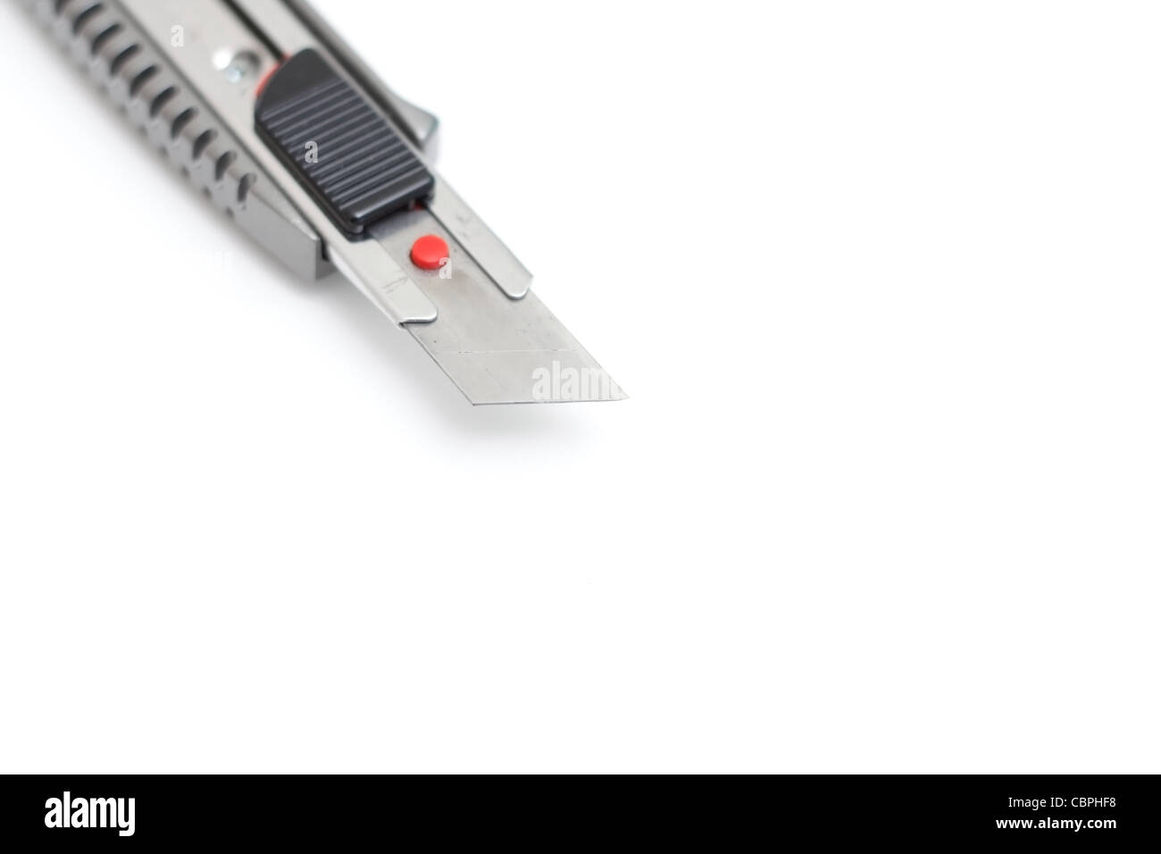 A construction knife isolated on white Stock Photo - Alamy