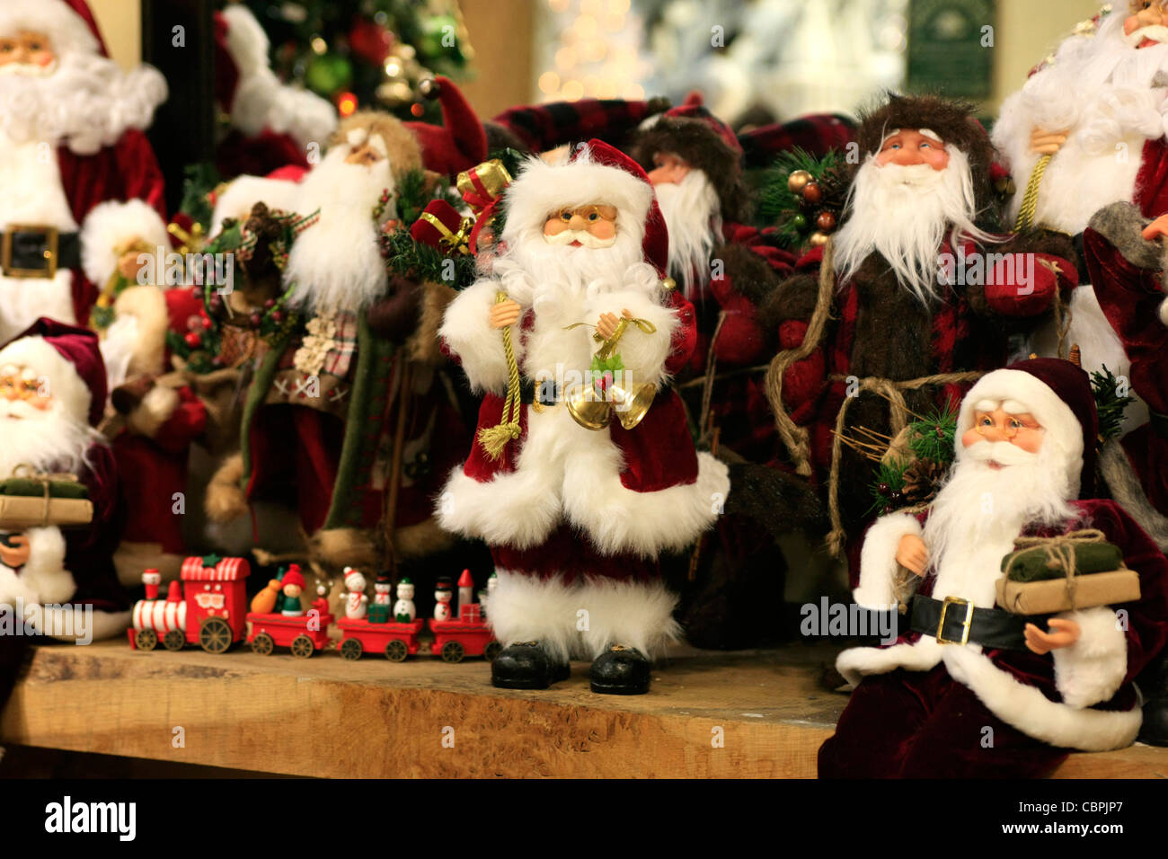Selection of Santa's in a Christmas toy store Stock Photo - Alamy