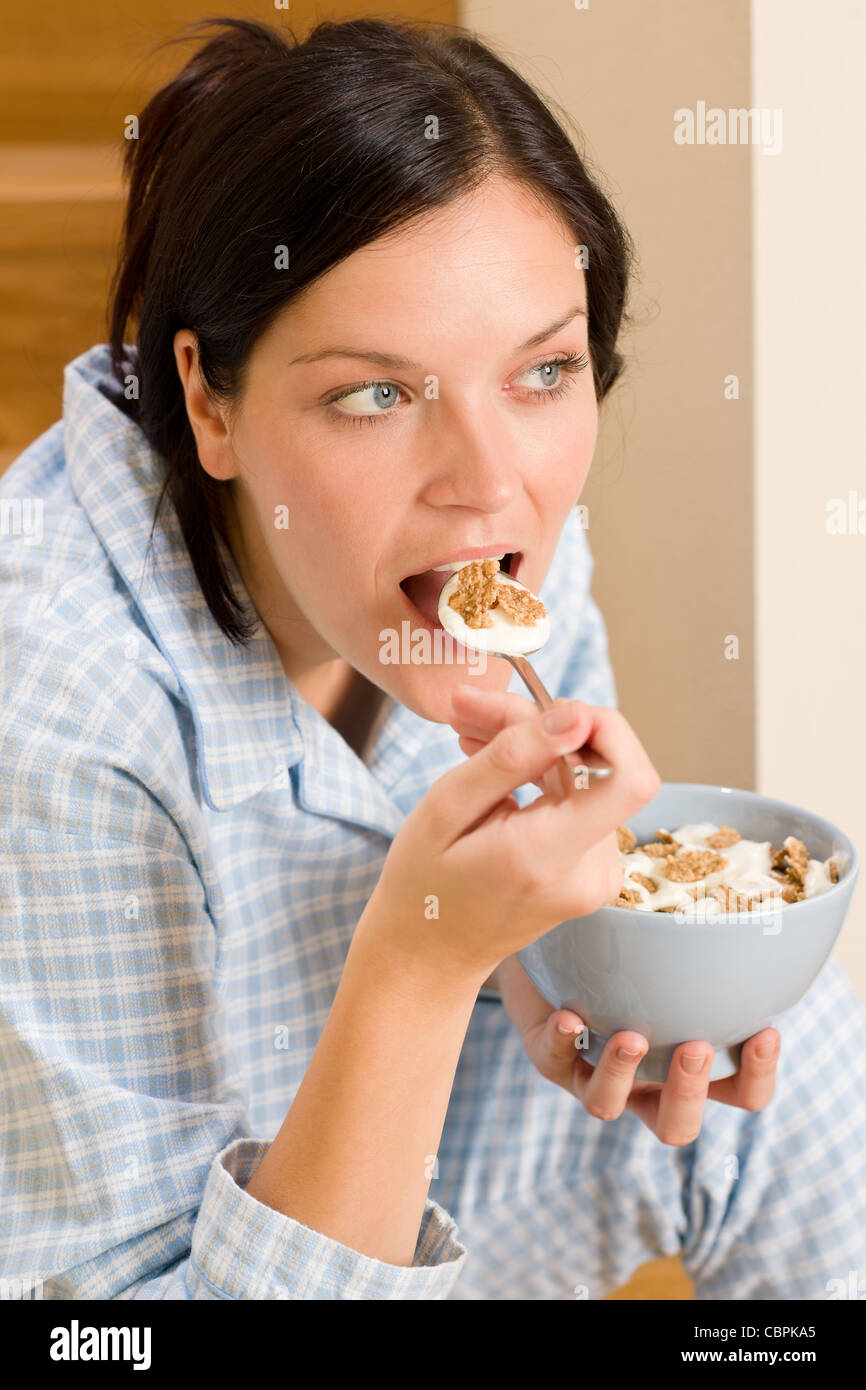 Home breakfast happy woman in pajamas eating cereals on stairs Stock ...