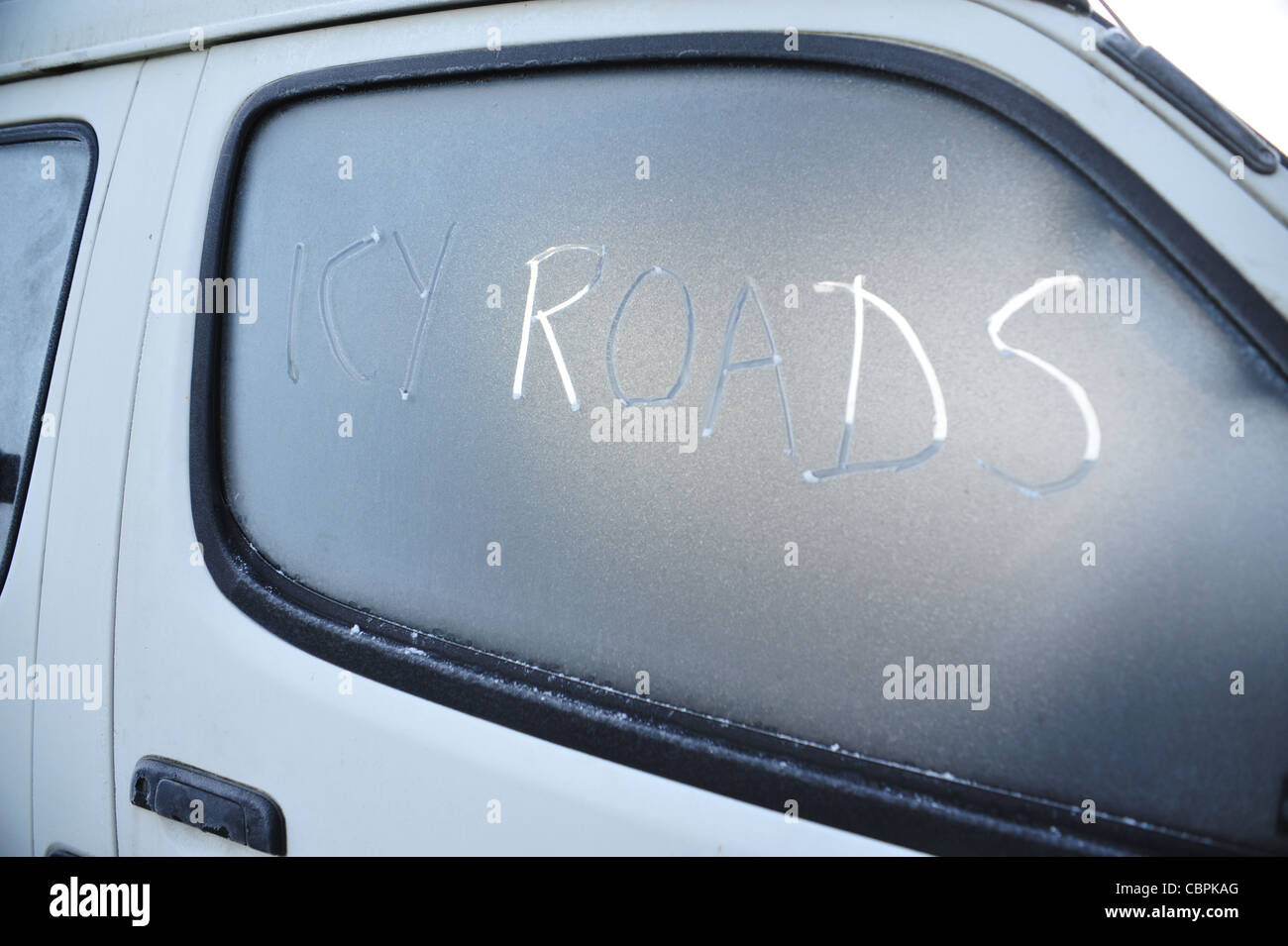 Warning written in frost on car window Stock Photo - Alamy