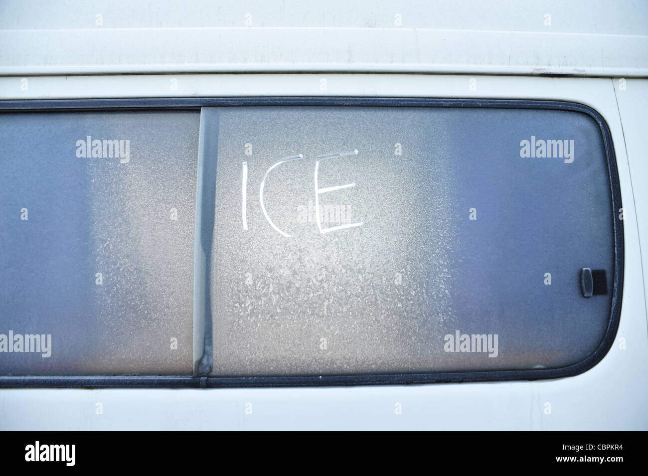 Warning written in frost on car window Stock Photo - Alamy
