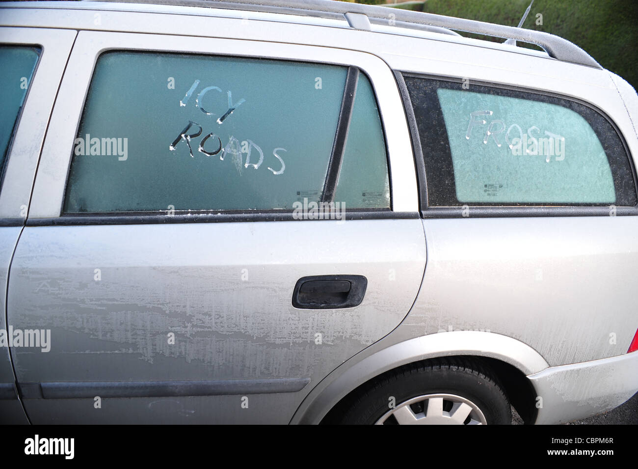 Warning written in frost on car window Stock Photo - Alamy