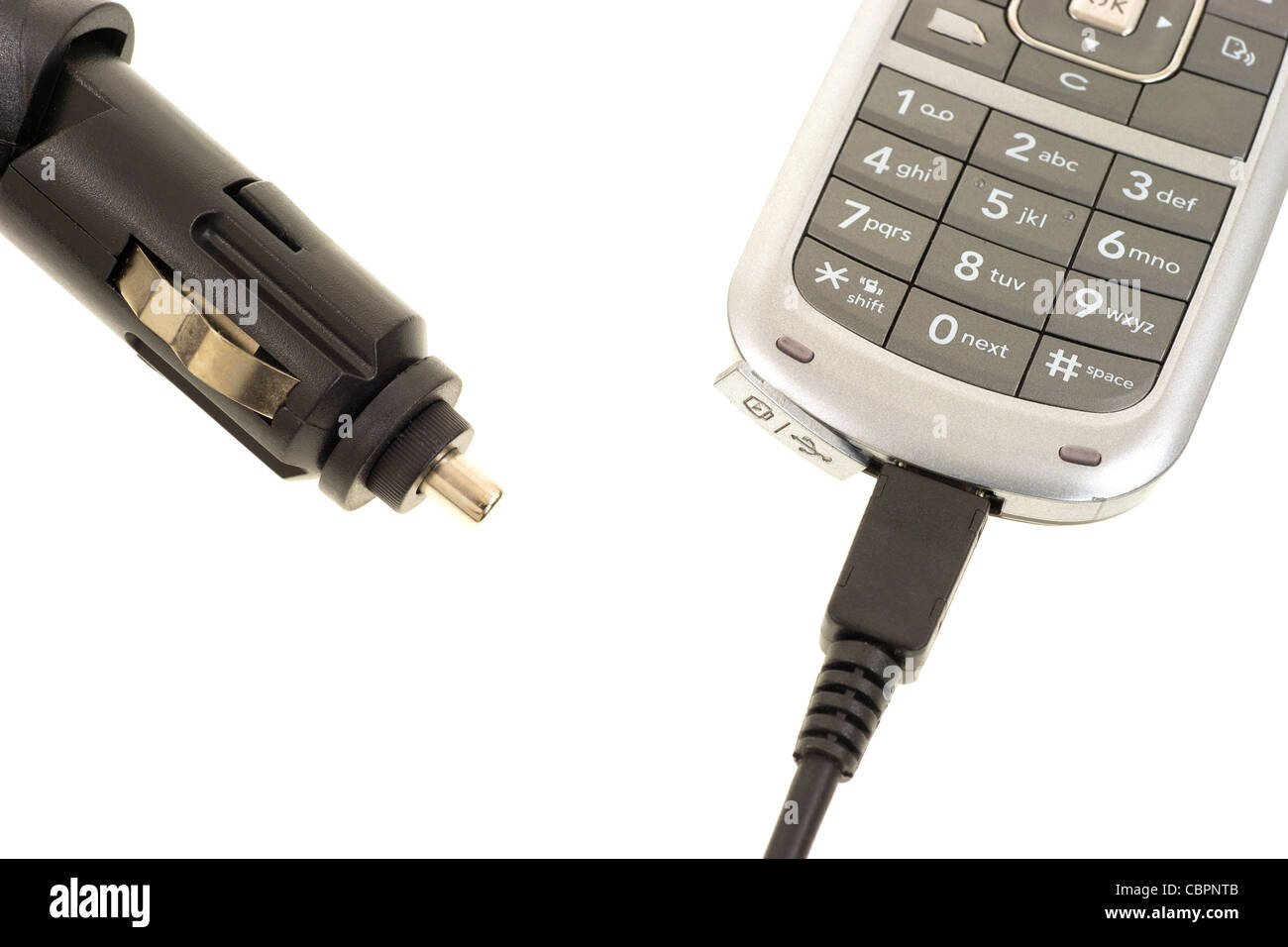 Cell phone with car adapter Stock Photo - Alamy