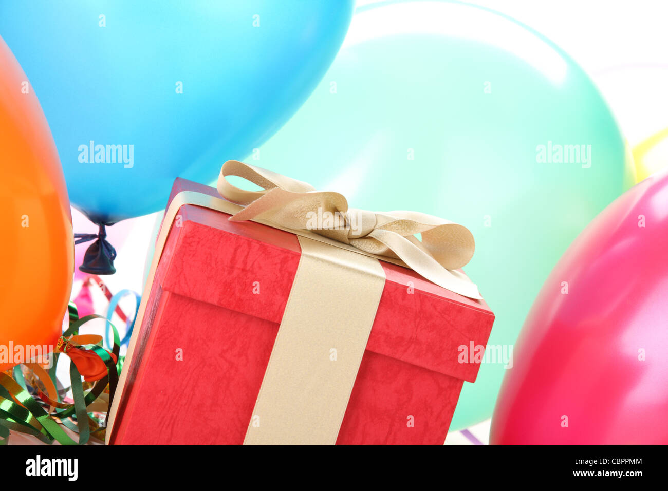 New Year's gift with balloons Stock Photo - Alamy