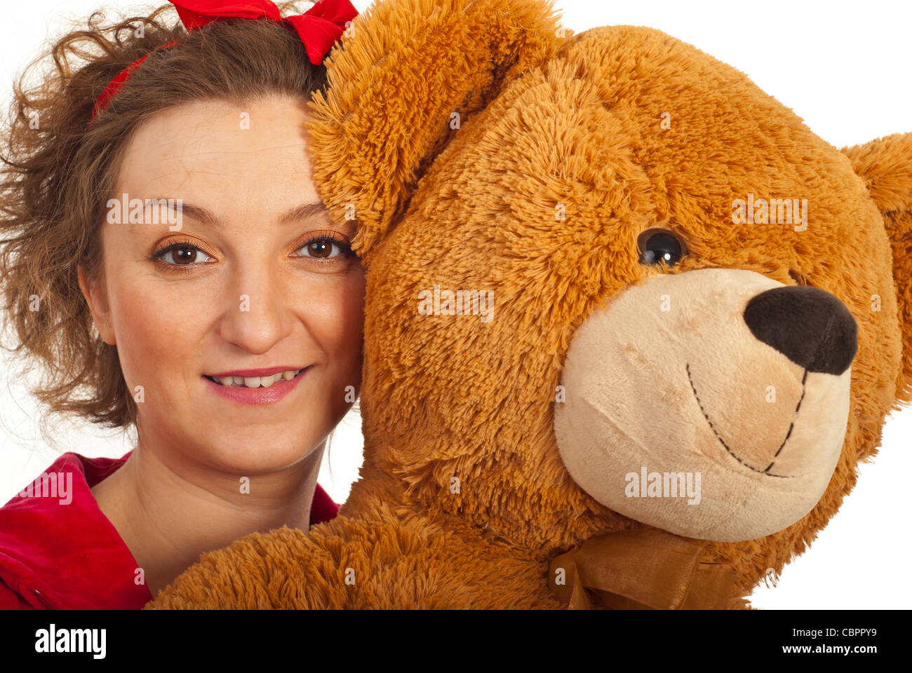 Close up of woman face holding big teddy bear against white background Stock Photo - Alamy