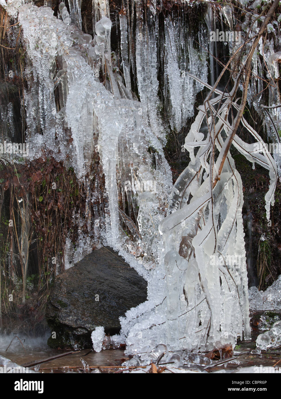 Little waterfall and needle ice Stock Photo - Alamy
