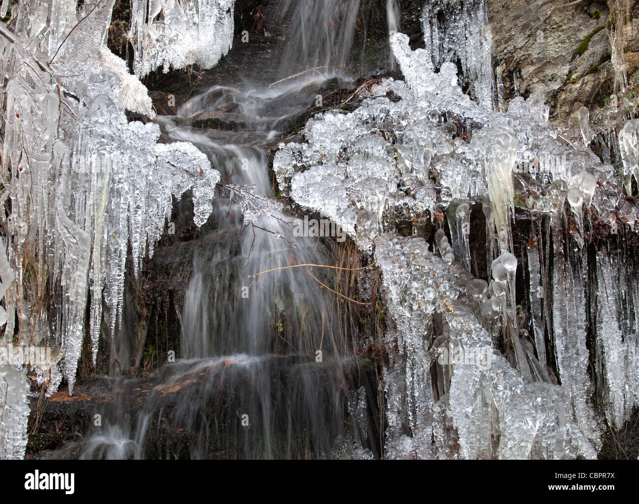 Little waterfall and needle ice Stock Photo - Alamy