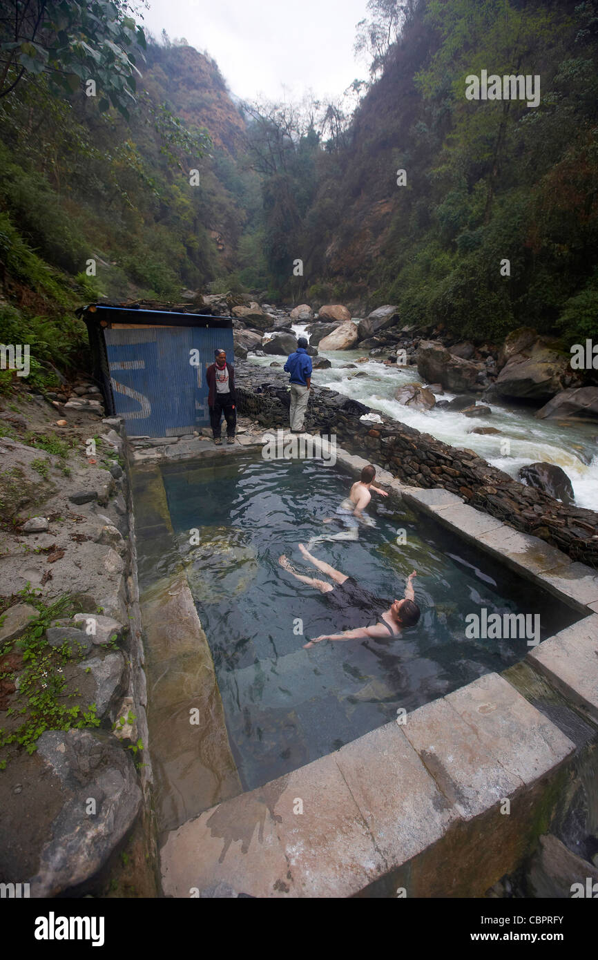 Trekkers relaxing in the hot springs near Chhomrong on the Annapurna ...