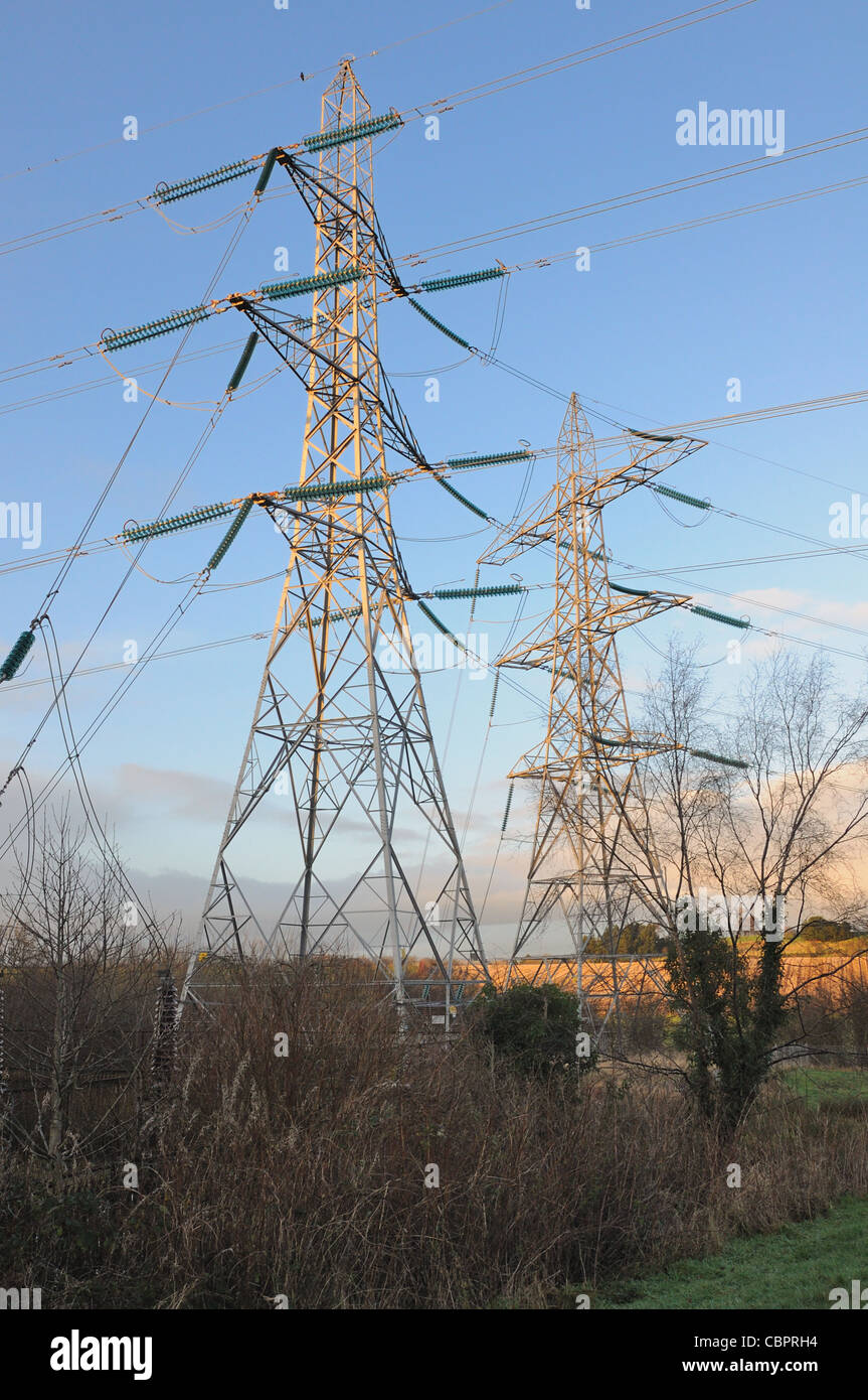 Two electricity pylons with multiple insulators and cables in the UK ...