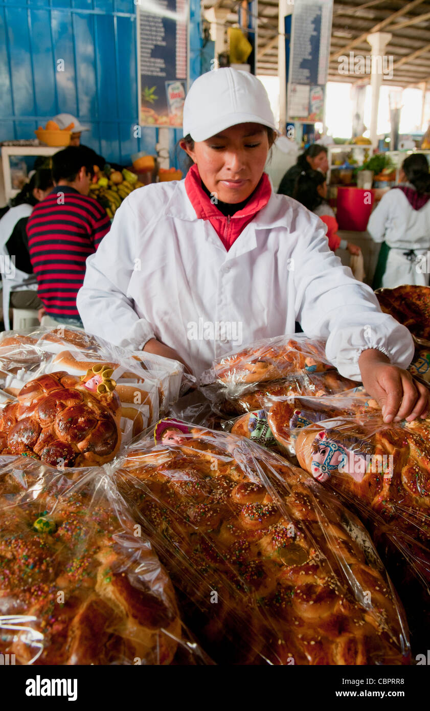 Traditional woman selling bread vendor in Cusco Cuzco Peru Stock Photo ...