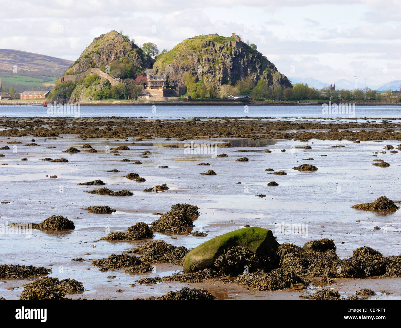 Dumbarton Rock with castle, River Clyde, and the tide is out Stock ...