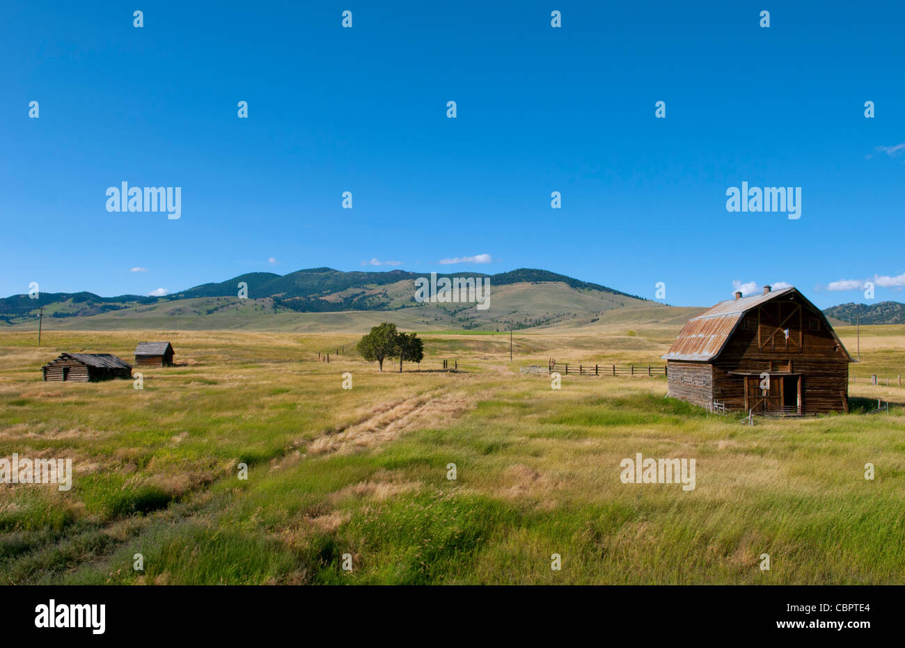 Old barn and field in remote Butte Montana Stock Photo - Alamy