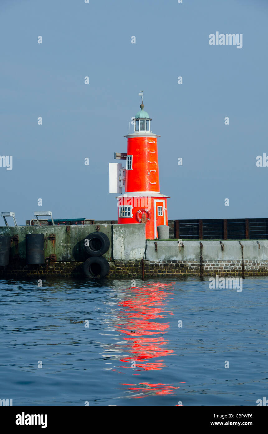 Denmark, Helsingoer. Brightly colored North Sea port lighthouse Stock ...