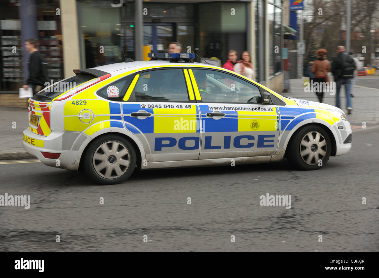 A police patrol car at speed in a busy city. Southampton, Hampshire ...