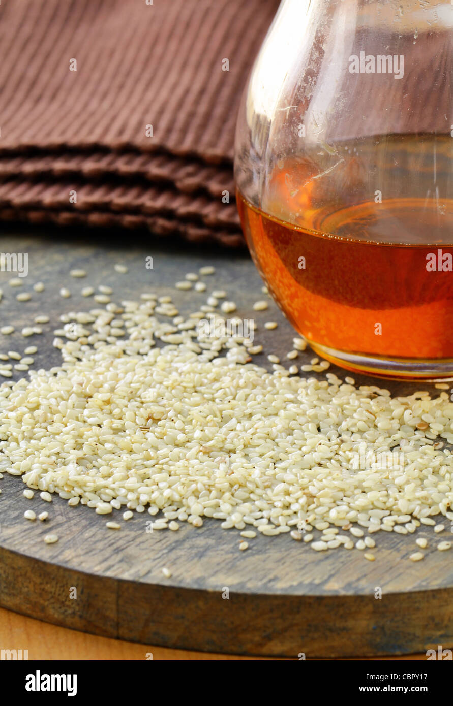 sesame seeds and sesame oil in a bottle Stock Photo - Alamy