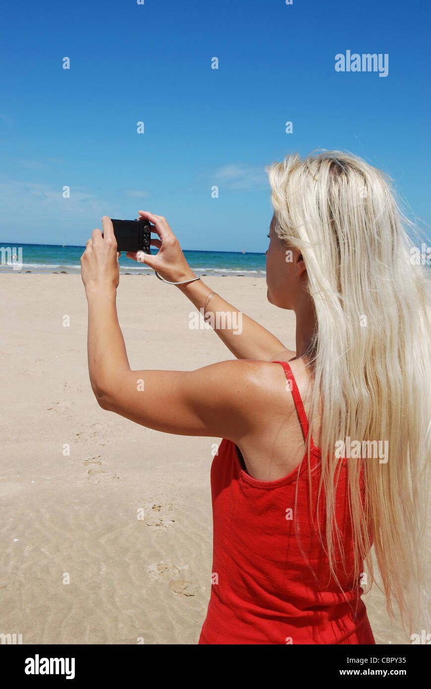 Woman taking picture Stock Photo - Alamy