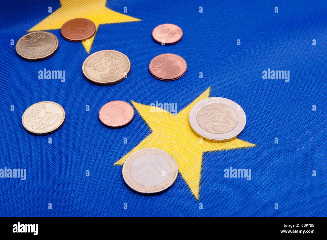 Euro coins on euro flag hi-res stock photography and images - Alamy