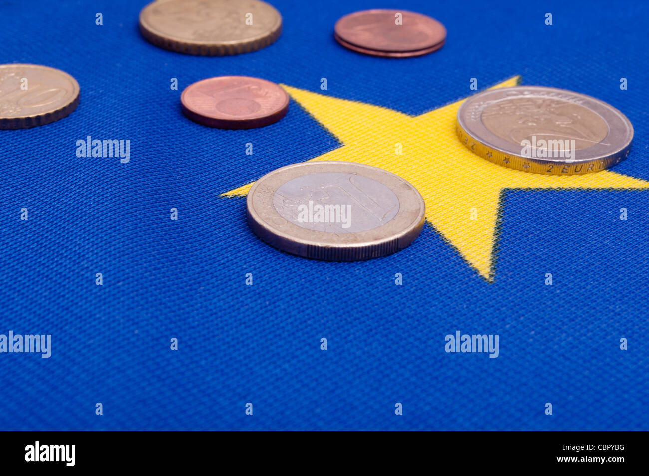 Euro coins on euro flag hi-res stock photography and images - Alamy